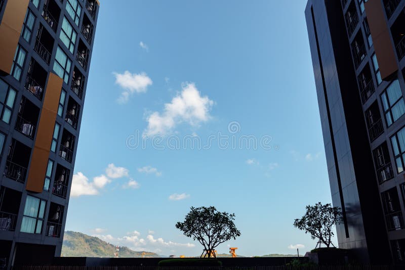 Clouds Float in Blue Sky between Modern Buildings Stock Photo - Image ...