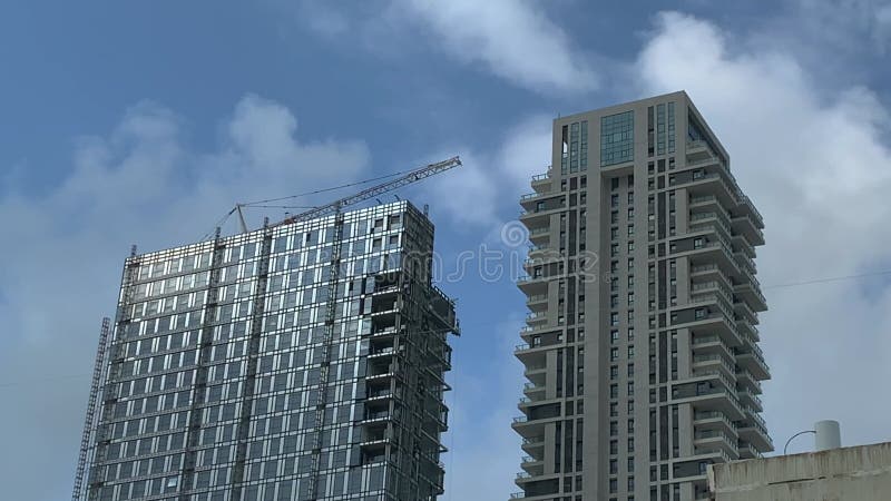 Clouds Float Over High-rise Buildings Under Construction, Time Lapse ...