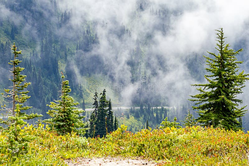 Clouds and Fog Move Over Mountain Views and Roads Below Stock Image ...