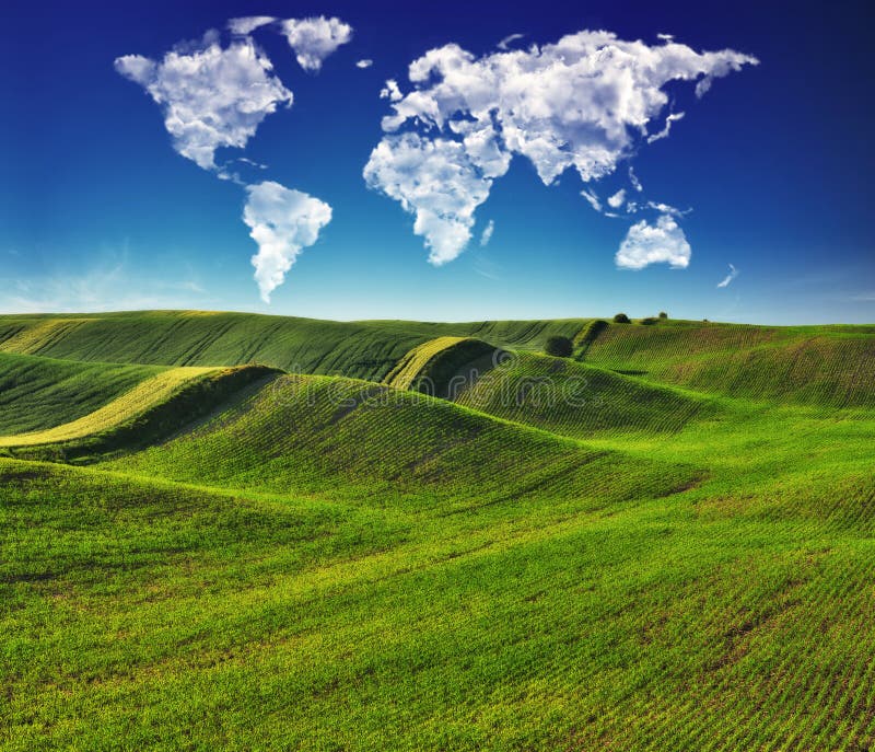 Clouds in the Form of a World Map Over a Green Field. Travel and ...