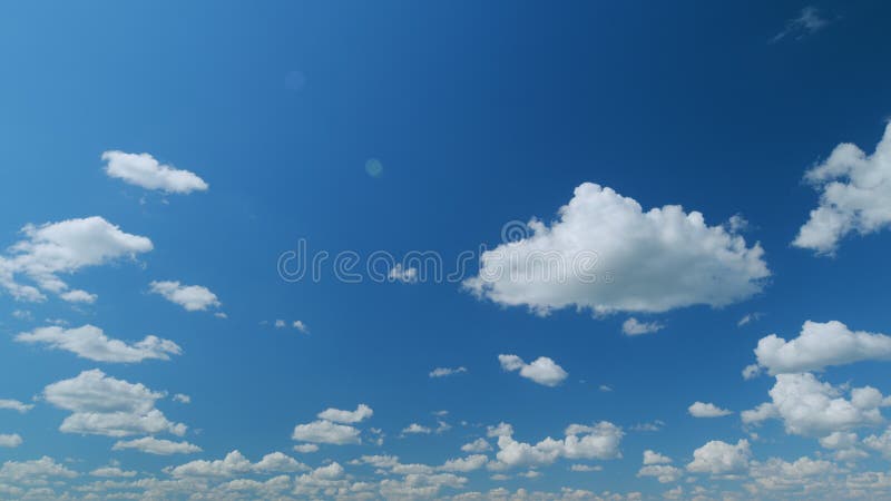 Clouds Formation Running Across the Blue Sky. White Puffy and Fluffy ...