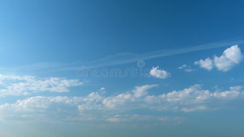 Clouds Formation Running Across the Blue Sky. White Puffy and Fluffy ...