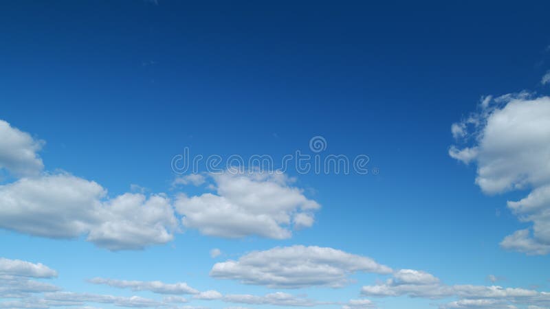 Clouds Formation Running Across the Blue Sky. White Puffy and Fluffy ...