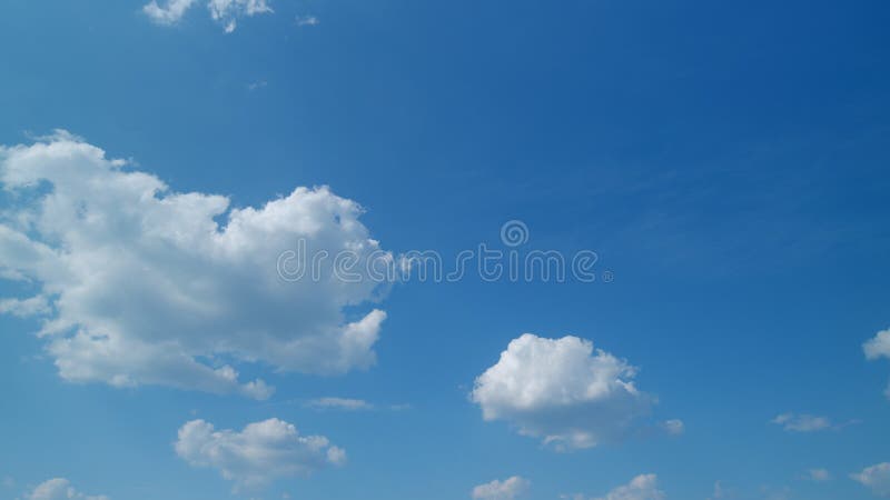 Clouds Formation Running Across the Blue Sky. White Puffy and Fluffy ...
