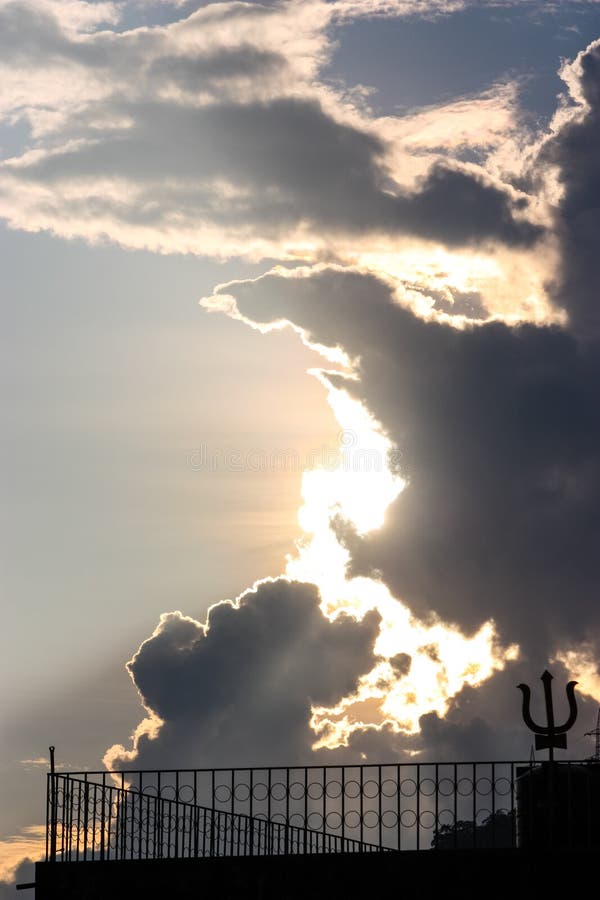 Clouds in Front of the Sun Create a Divine Scene with a Sacred Symbol ...