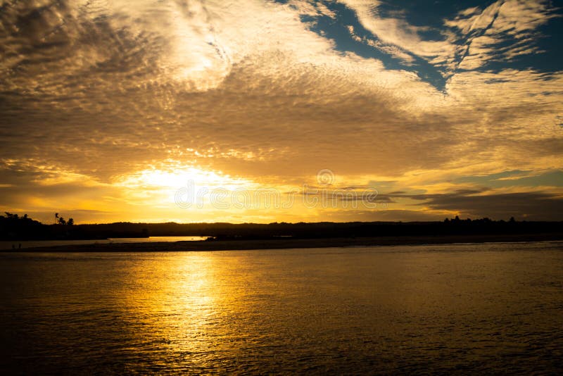 Clouds of Golden Colors during the Fall of the Sun Stock Photo - Image ...
