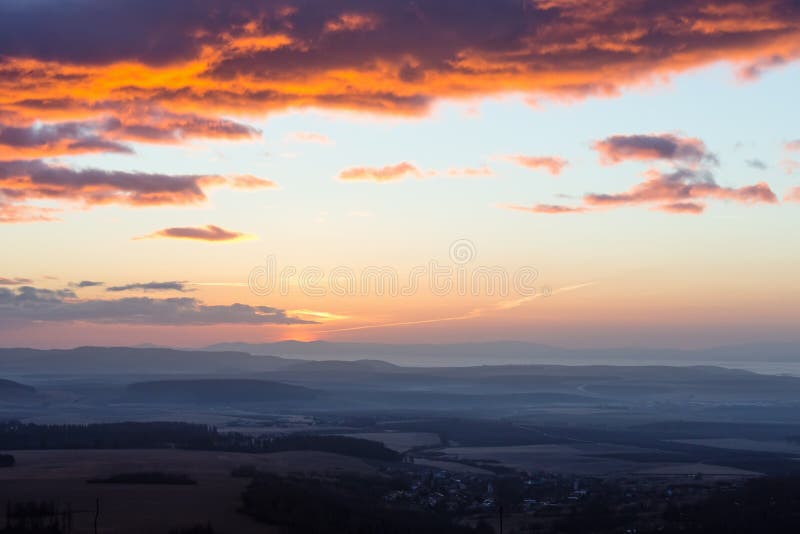 Clouds Illuminated by Morning Sun Over Valley. Stock Image - Image of ...