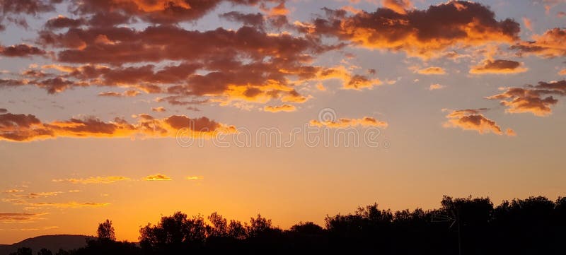 The Clouds are Illuminated by the Red Light of the Sunset Stock Image ...