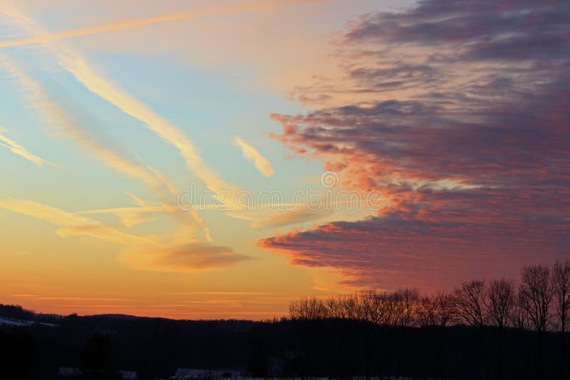 Clouds and jet trails stock image. Image of orange, white - 113217715