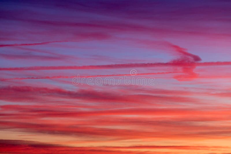Clouds and Jet Vapor Trails Creating Beautiful, Colorful Texture in the ...