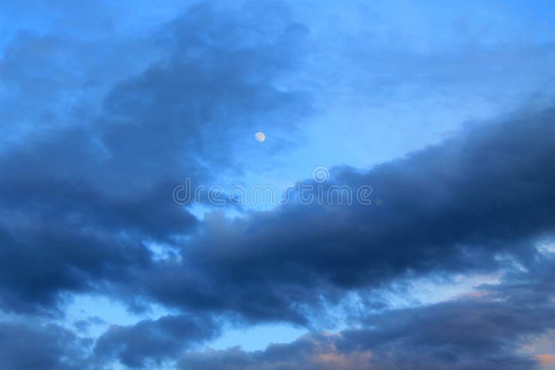 Clouds and Moon in Evening Sky Stock Photo - Image of light, heaven ...
