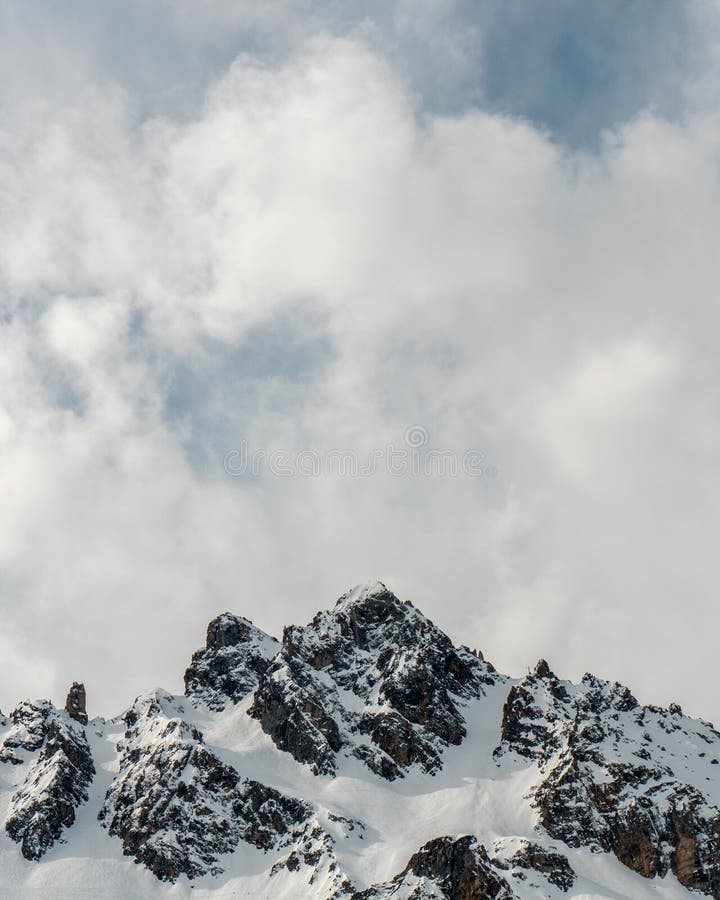 Mountain Peak with Cloudy Skies Stock Photo - Image of winter ...