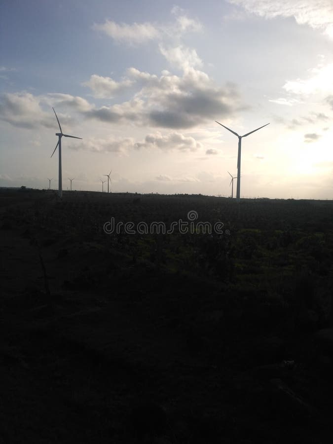 Clouds Moving Behind Windfans Stock Photo - Image of windfans, wind ...