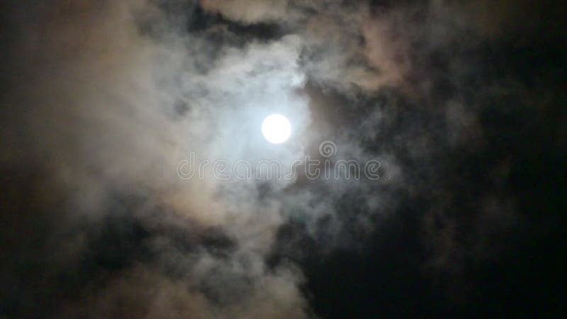Clouds are Moving through the Full Moon, the Atmosphere Looks ...