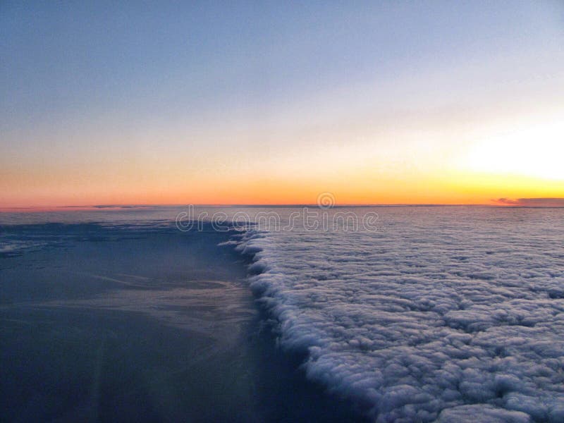 Clouds and the Ocean in the Sunset from Above, from an Airplane Stock ...