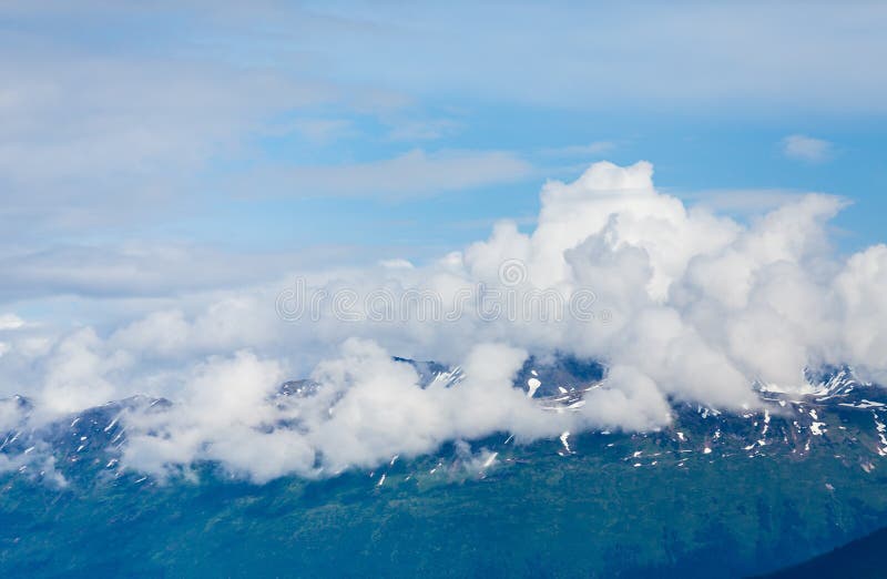 Clouds Over Blue Alaskan Mountains Stock Photo - Image of mountains ...