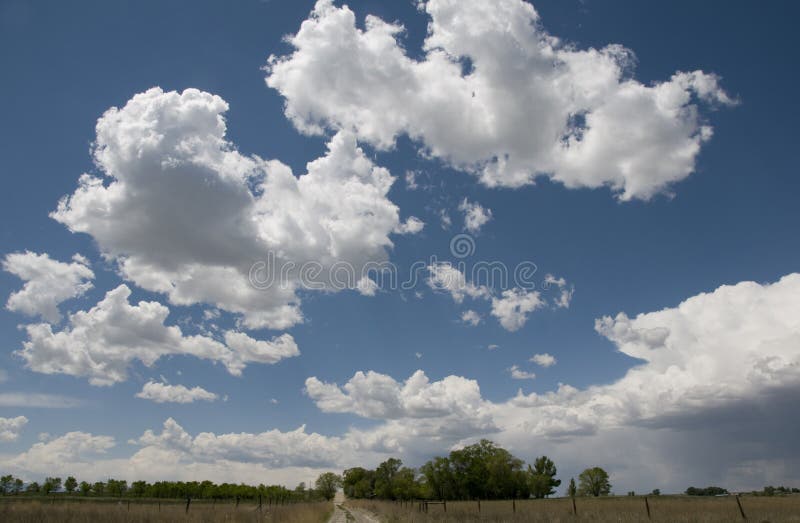Clouds over country road stock photo. Image of rural - 11197008