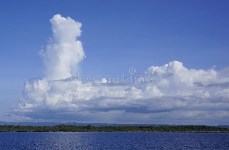 Clouds over the island stock photo. Image of illusion - 64842460