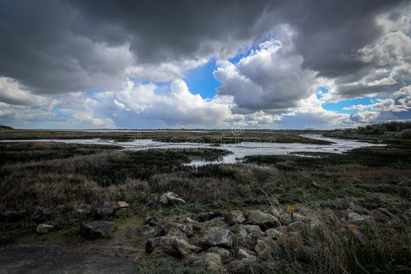 Clouds over the marshes. stock photo. Image of outdoor - 147160014