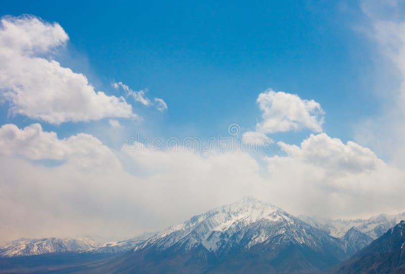 Clouds over mountains stock photo. Image of lifeless, mount - 9799506