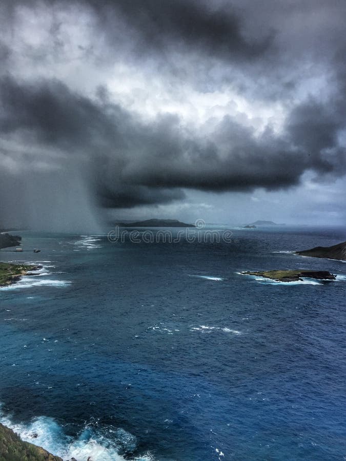 Clouds over the ocean stock image. Image of island, dangerous - 184420119