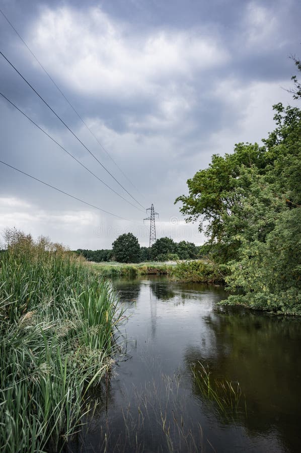 Clouds Over the River, the Grassy Bank of the River, Stock Image ...