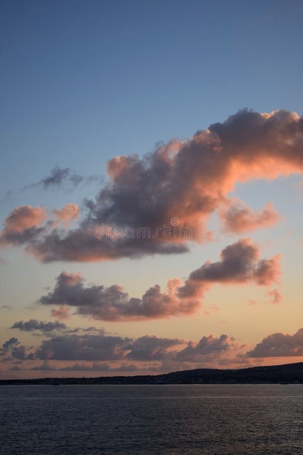 Clouds over the sea stock image. Image of illuminated - 120583367