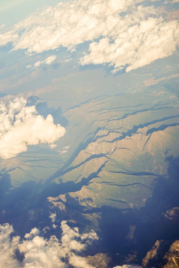 Clouds Over Snow Clad Austrian Alps Mountains Seen from an Airplane ...