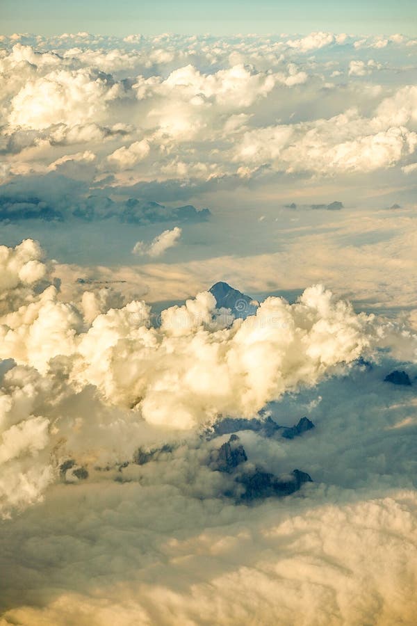 Clouds Over Snow Clad Austrian Alps Mountains Seen from an Airplane ...