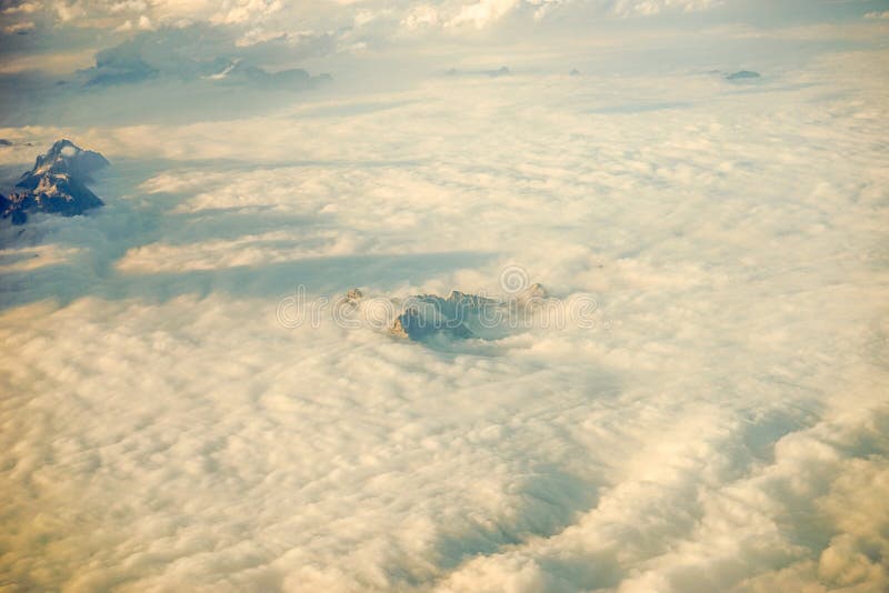 Clouds Over Snow Clad Austrian Alps Mountains Seen from an Airplane ...