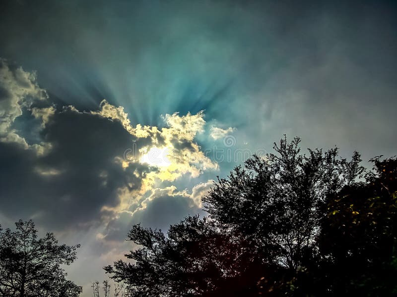 Clouds Over the Sun in the Blue Sky Stock Photo - Image of midday, blue ...
