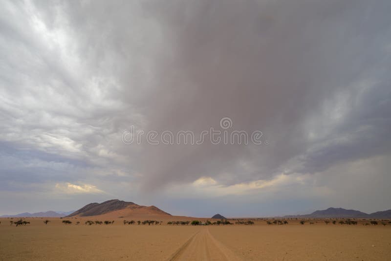 Clouds with a Promise of Rain Over the Desert Stock Photo - Image of ...