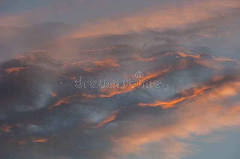 Clouds Reflect Light and Colors at Sunset. Stock Image - Image of ...