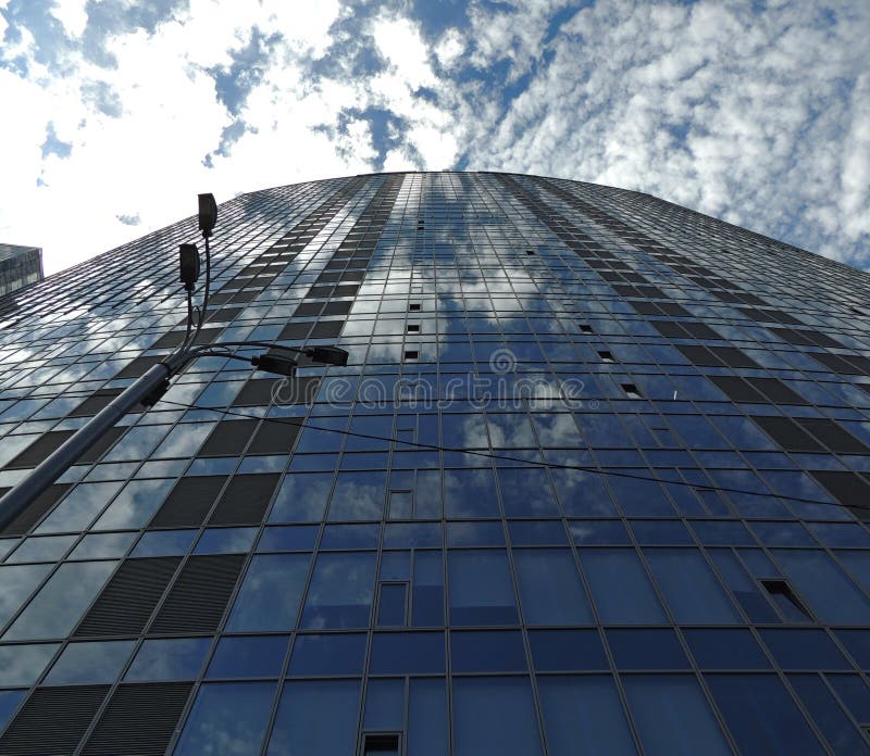 Glass Surface of Front Part of City Skyscraper with Sky Reflection in ...