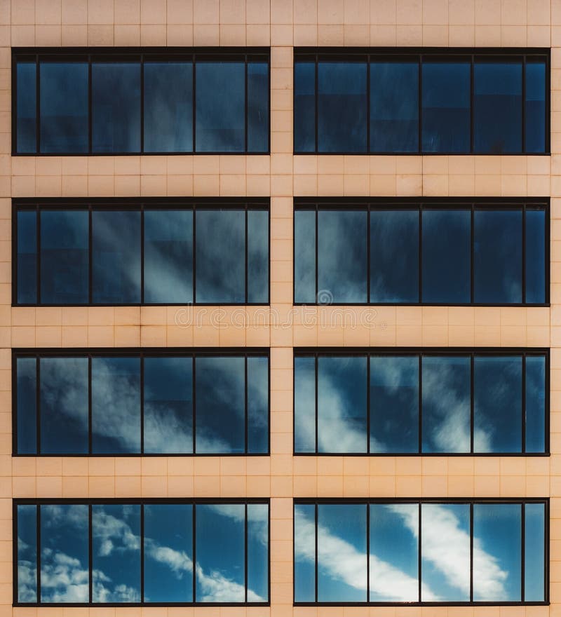 Clouds Reflected in Windows of an Office Building Stock Photo - Image ...
