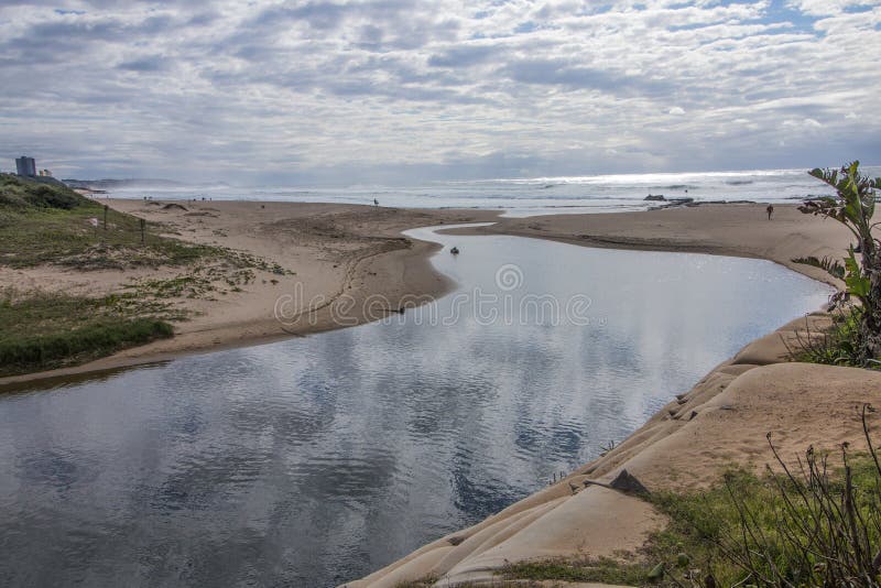 Clouds Reflecting on River Flowing into the Sea Stock Image - Image of ...
