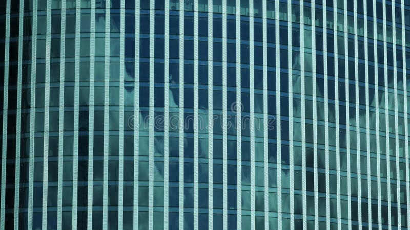 Modern Glass Skyscraper Reflecting Clouds in Windows Forming Repeating ...