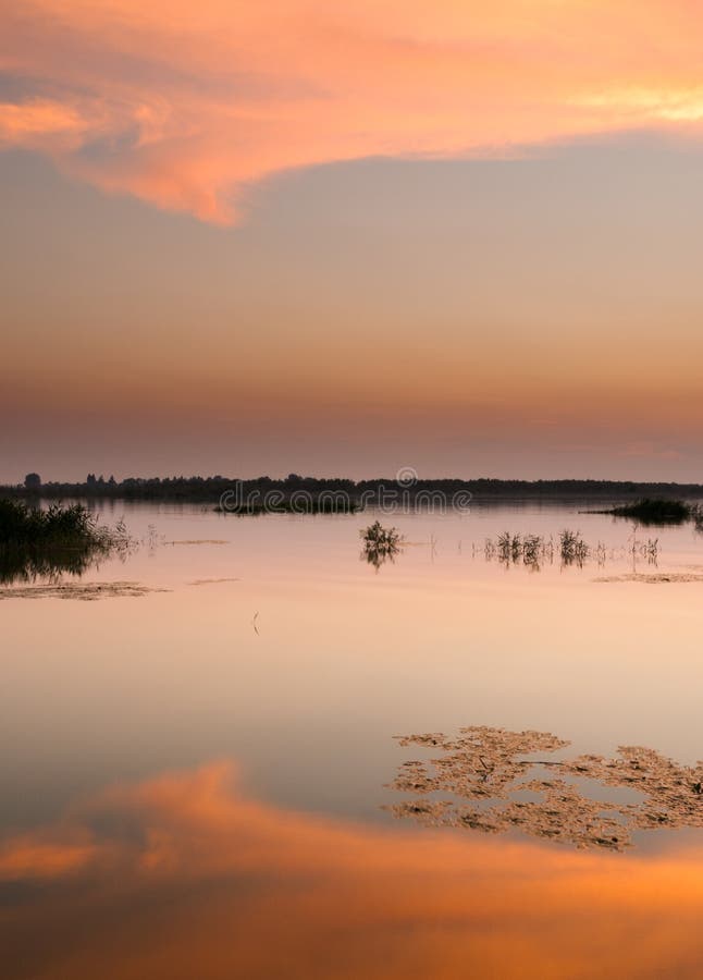 Clouds Reflection in Water at Sunset Stock Photo - Image of calm, lake ...