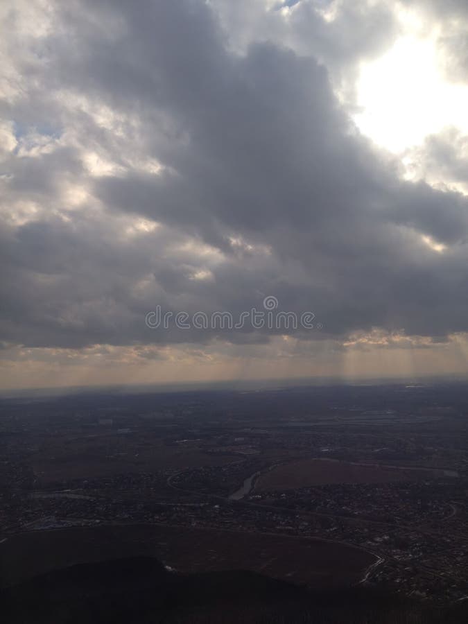 View from the Plane. Bird S-eye View. Sunlight through Clouds. Clouds ...