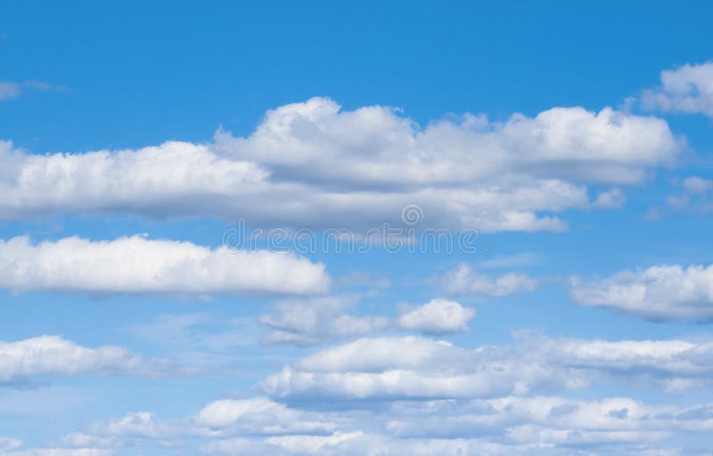 Clouds of Scattered Clouds Moving Across a Blue Sky Stock Photo - Image ...