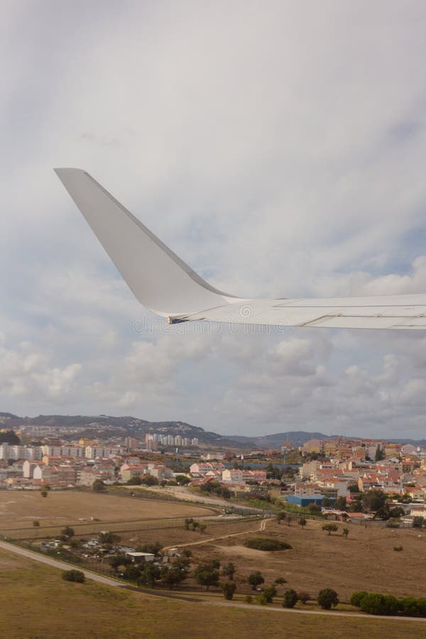 Clouds in the Sky Behind the Wing of an Airplane Stock Photo - Image of ...