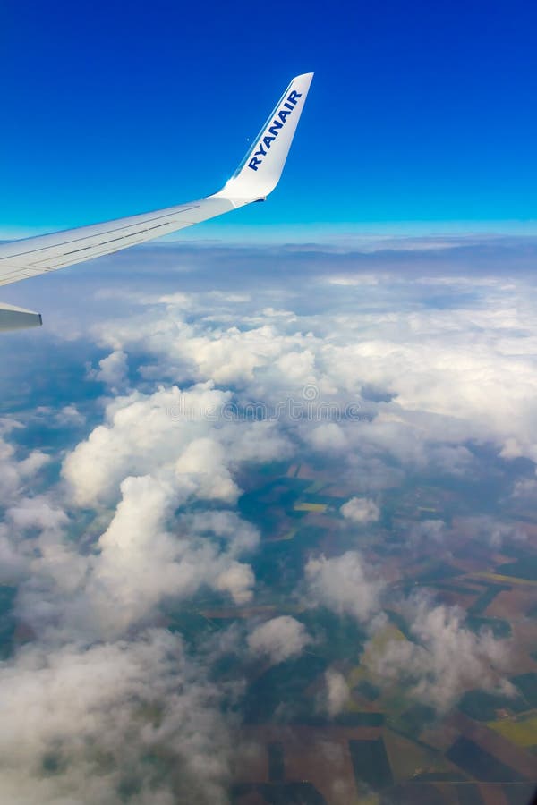 Clouds, Sky and Earth in Window of Aircraft Editorial Stock Photo ...