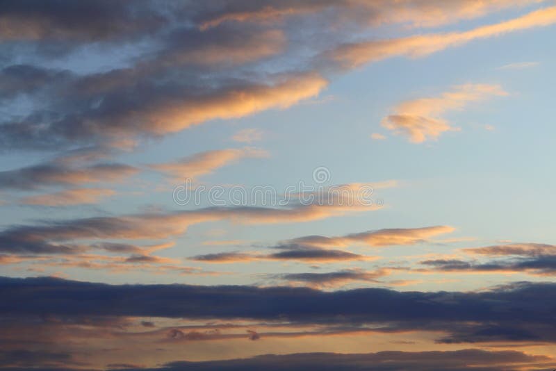 Clouds in the Sky are Illuminated from Below by the Red Light of the ...