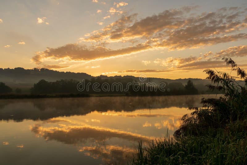 Cloud Reflection on the Water at Sunrise Stock Photo - Image of river ...