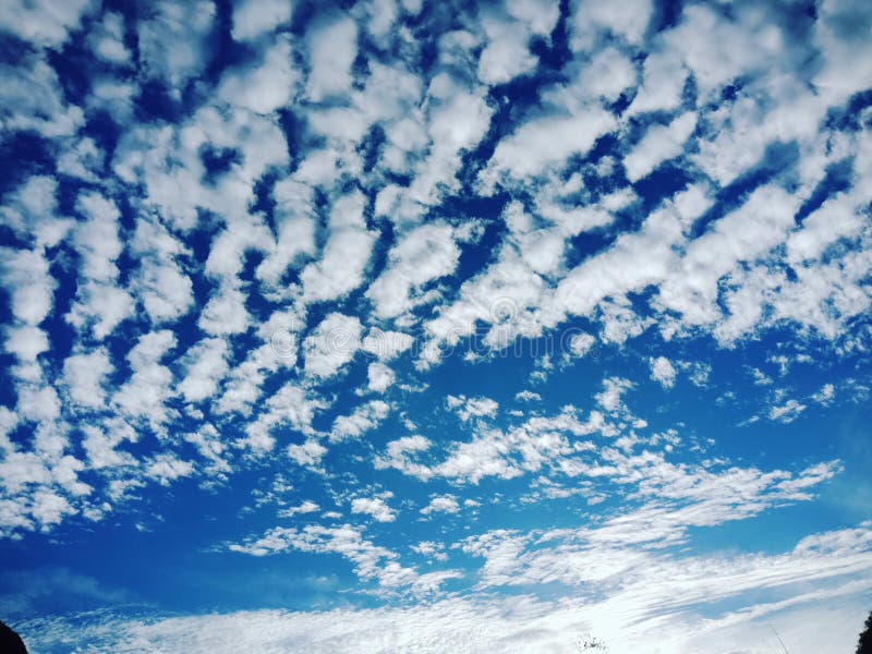 The Clouds are between the Sky and the Light Above the Earth Stock ...