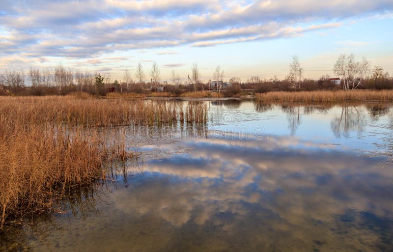 Clouds in the Sky with Reflection in the Lake at Sunset. Stock Image ...