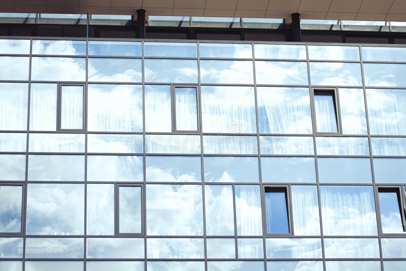 Clouds and Sky Reflection on Windows of a Modern City Building Stock ...