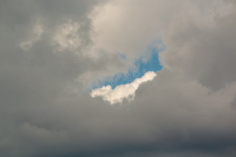 Clouds in the Sky with a Spot of Clear Blue Sky Stock Photo - Image of ...