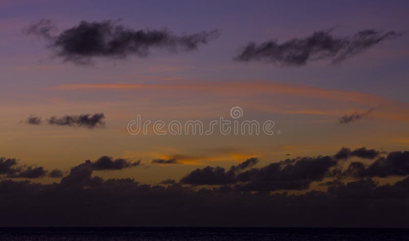 Clouds during sunset stock image. Image of exterior - 239340083