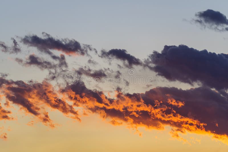 Clouds at sunset stock photo. Image of illuminated, altocumulus - 216519814